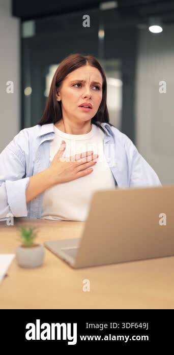 Female professional experiences sudden, sharp chest pain and breathing ...