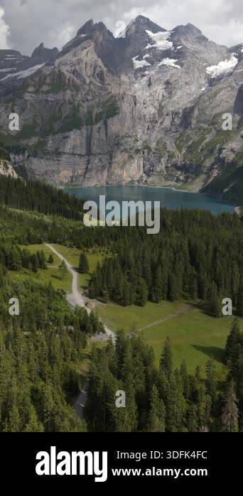 Aerial drone video of Lake Oeschinen, a UNESCO-listed alpine lake ...
