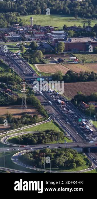 Vertical aerial video of highway congestion in Milan, showing dense ...