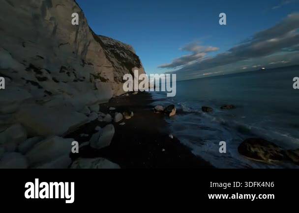 High-speed FPV aerial drone footage flying along the limestone ...