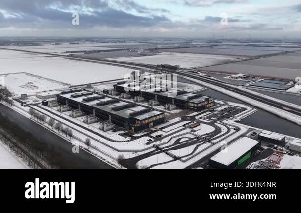 Aerial drone video of a datacenter in winter, showing cloud ...