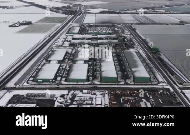 Aerial drone video of a datacenter in winter, showing cloud ...
