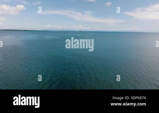 Open ocean view with calm waters meeting horizon. Siargao, Philippines ...