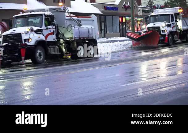 NORWALK, CT, USA - DECEMBER 27, 2025: Street plows work to clear snow ...