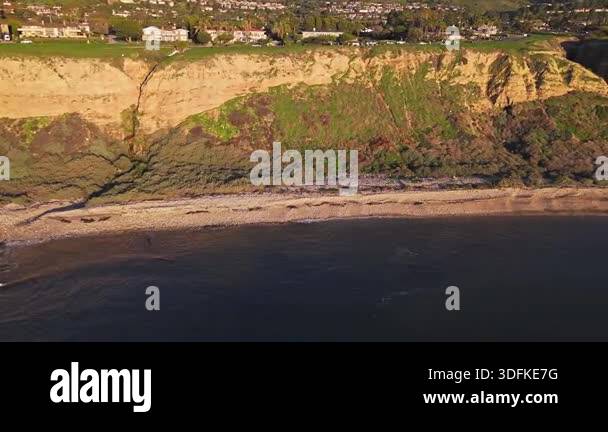 Aerial truck shot of breathtaking Lunada Bay as the sun sets ...