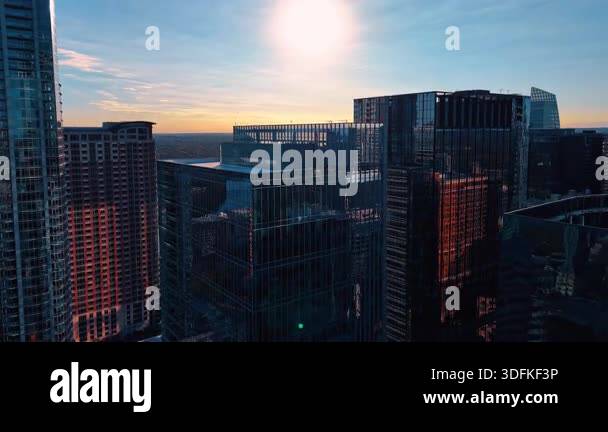 Rising over the tops of high-rises in Austin, Texas, USA. Revealing ...