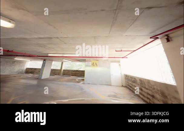 Multilevel parking garage lot at the modern skyscraper building. Car ...