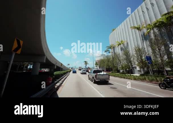 Urban highway from moving vehicle, crossing an elevated bridge with ...