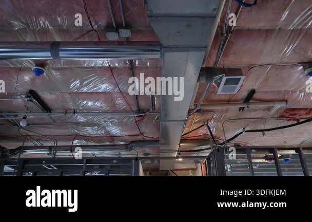 POV HVAC system under installation with exposed airducts, insulation ...
