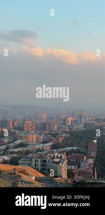 Yerevan shows a hazy skyline with buildings and streets obscured by ...