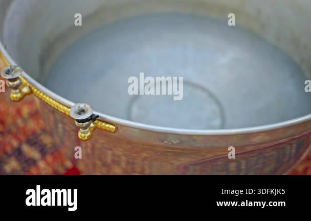 Ornate Brass Basin On Patterned Rug, CloseUp Empty Embossed Basin With ...