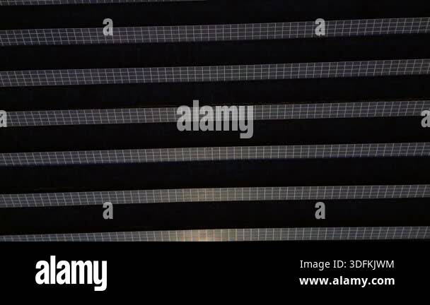 Large grid of photovoltaic solar panels from an aerial view, producing ...