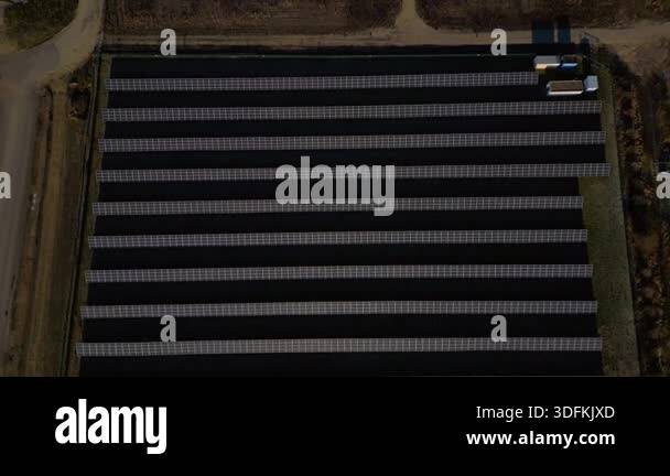 Large grid of photovoltaic solar panels from an aerial view, producing ...