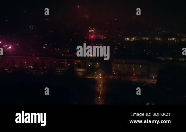 Aerial view of Berlin city at night, with multiple colorful fireworks ...