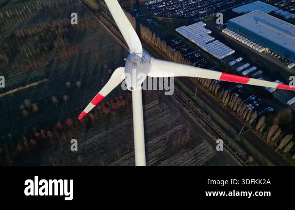 closup of Wind turbine close up with many turbines, solar panels, and a ...