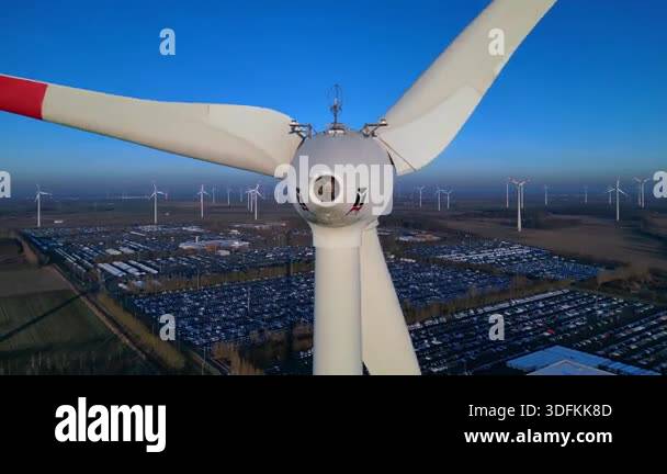 closup of Wind turbine close up with many turbines, solar panels, and a ...