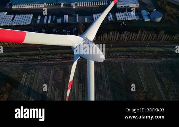 closup of Wind turbine close up with many turbines, solar panels, and a ...