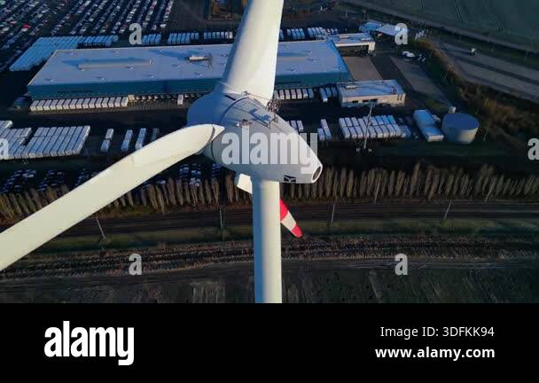 closup of Wind turbine close up with many turbines, solar panels, and a ...
