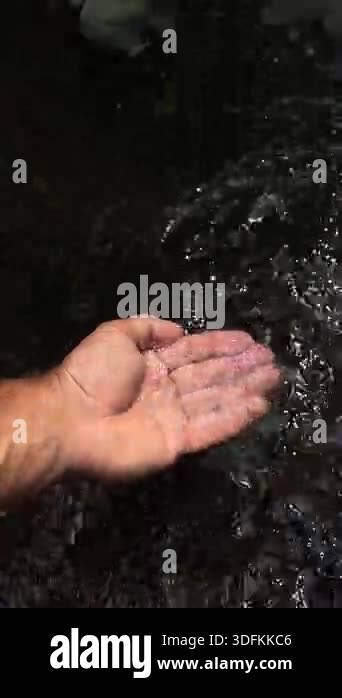 Caucasian Man Cupping Stream Water Over Mossy Stones, Droplets Falling ...