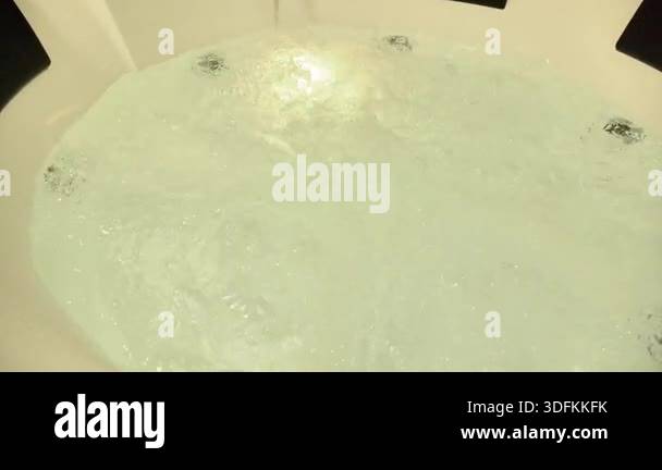Bathing in a jacuzzi.Water bubbling in the bathtub. Cleanliness ...