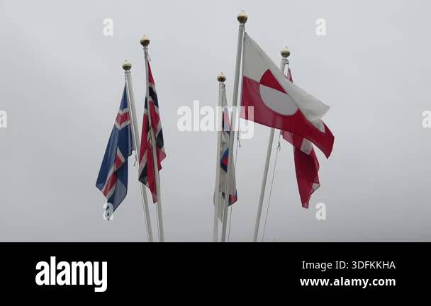 National flags of Iceland, Norway, Denmark, and Greenland blowing in ...