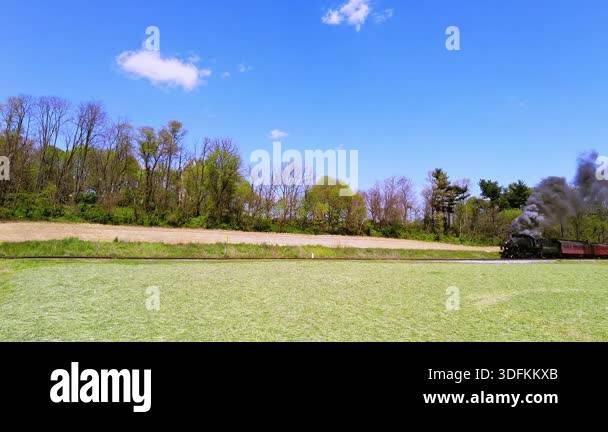 Paradise, Pennsylvania, April 22, 2024 - A steam train moves along ...
