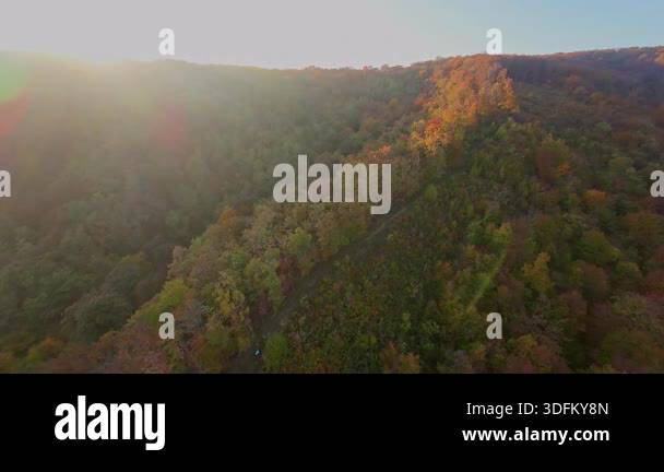 An exhilarating ride down a scenic mountain biking trail through a ...