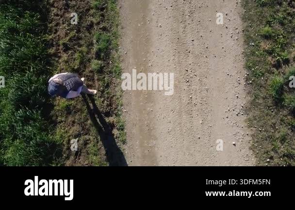 Hiker Standing by Dirt Road as Van Passes Stock Video Footage - Alamy