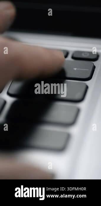 A vertical video of a finger actively pressing the Backspace key on a ...
