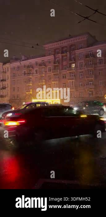 KYIV, UKRAINE - DECEMBER 28,2025: Night traffic jams form on snowy ...
