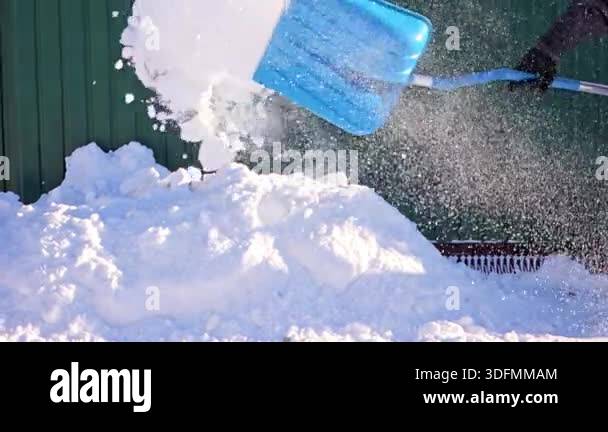 Clearing a road in winter. Seasonal outdoor work. shoveling snow big ...