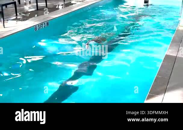 Front view of a women swimming laps in a pool Stock Video Footage - Alamy