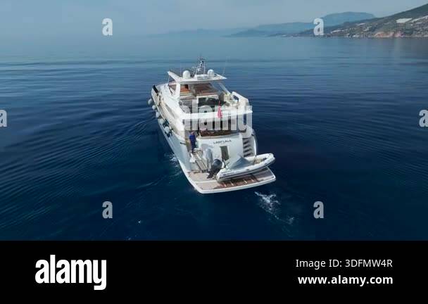 Luxury yacht gliding smoothly across wide open waters Stock Video ...