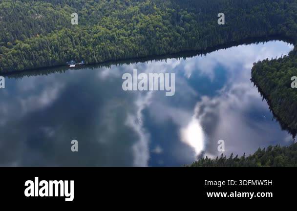 A completely isolated chalet on the shores of a mirror-like lake ...