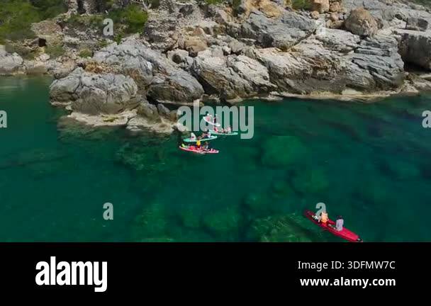 Couple relaxing and paddling together far from shore Stock Video ...