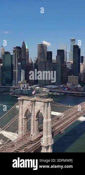 Vertical video shows the iconic Brooklyn Bridge, beautifully framed by ...