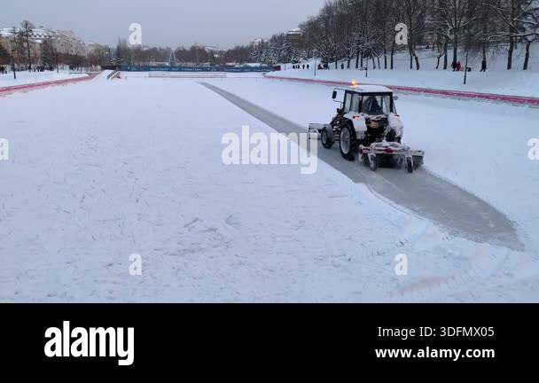 RUSSIA, KAZAN 03-01-2019: Snow plows clearing an ice rink during after ...