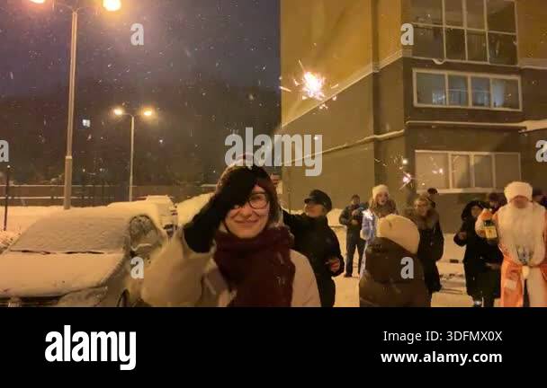 RUSSIA, KAZAN. 31-12-2018: People burning sparklers outside Celebrating ...
