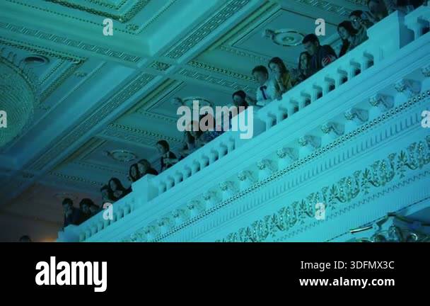 KAZAN, RUSSIA. 30-03-2019: People standing on the balcony and watching ...