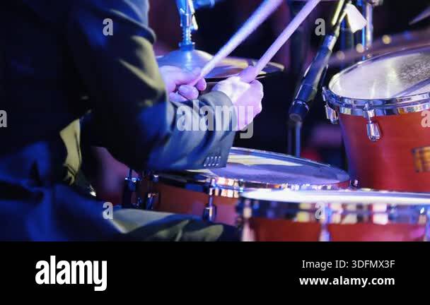 A man playing drums at the jazz concert. Back view. Mid shot Stock ...