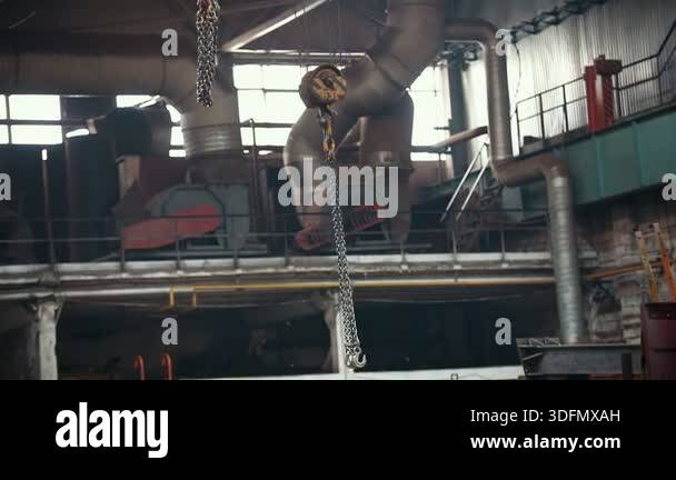 Industrial concept. Construction plant. A big lifting hook hanging on a ...