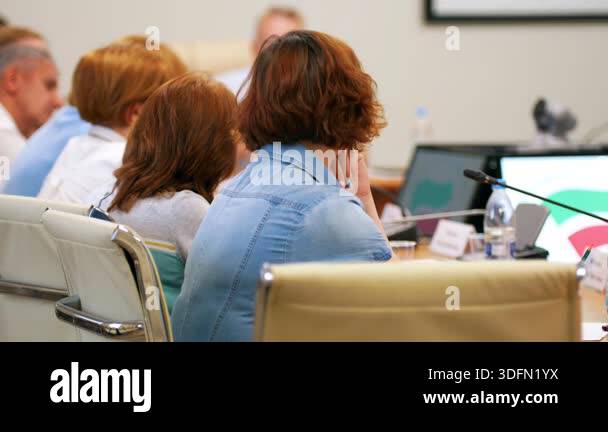 People sitting on the conference in the hall. Mid shot Stock Video ...