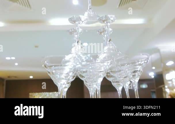 Pyramid of empty champagne glasses ready for pouring at a luxurious ...