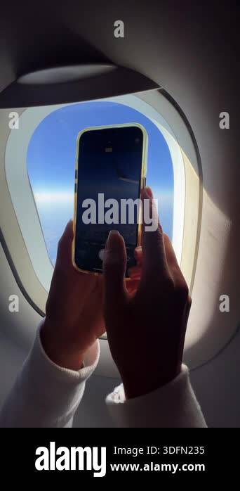 Traveler holding a steady camera capturing the bright blue sky through ...