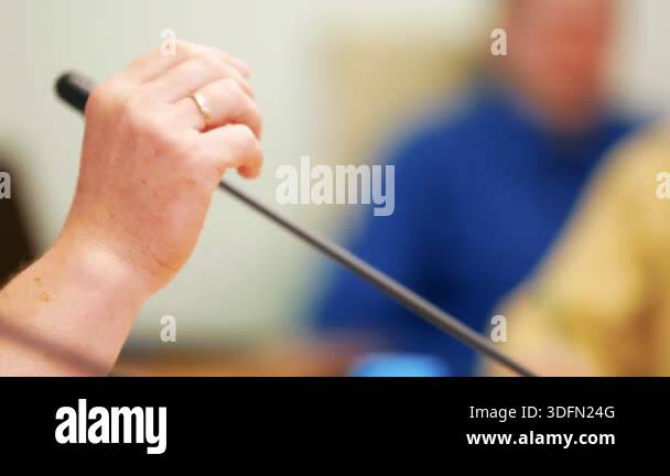 A male politician speaking into the microphone and actively ...