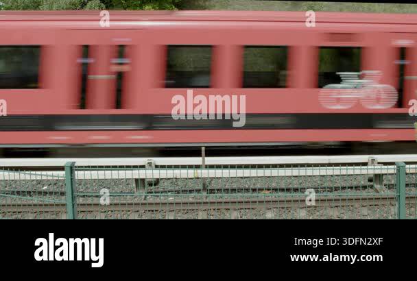Close-up of Helsinki Metro subway train passing by in summer, Kulosaari ...