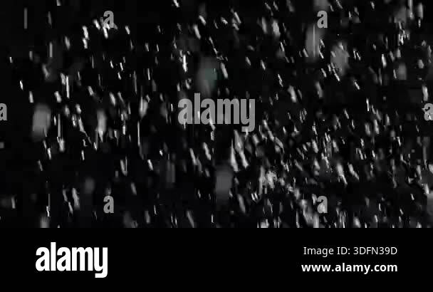 Dust particles or white snow scatter haphazardly through the air and ...