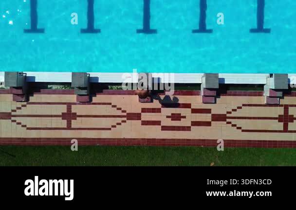 Aerial View of Swimmers Jumping into the Pool Stock Video Footage - Alamy