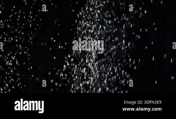 Dust particles or white snow scatter haphazardly through the air and ...