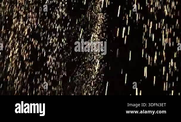 Dust particles or white snow scatter haphazardly through the air and ...